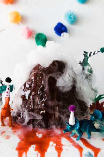 Exploding Volcano Cake with dinosaurs! - Oh So Delicioso